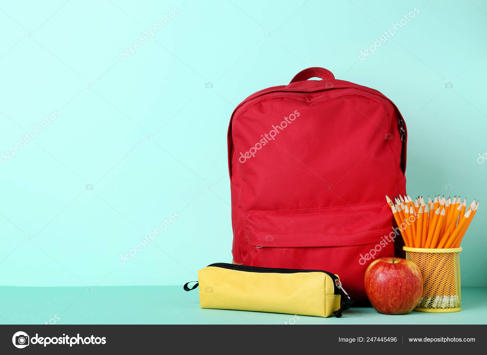 Red backpack with school supplies on mint background Stock Photo by ...
