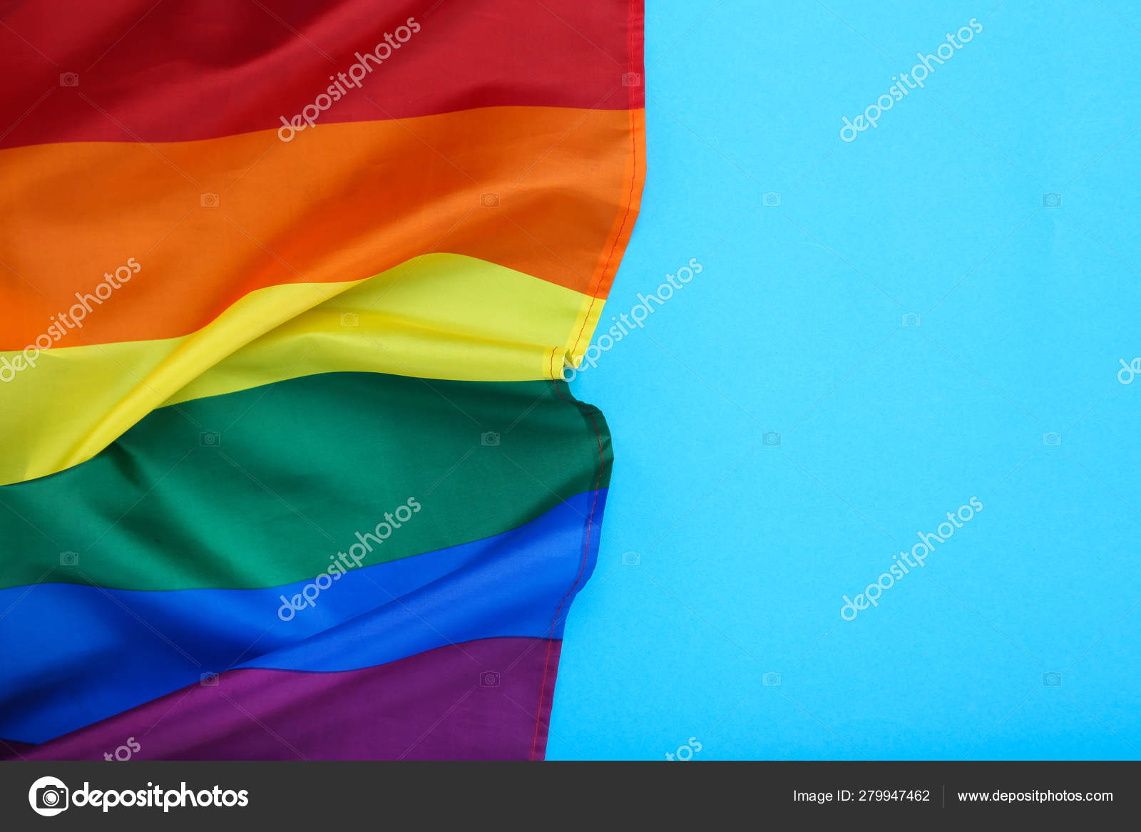 Rainbow flag on blue background Stock Photo by ©5seconds 279947462