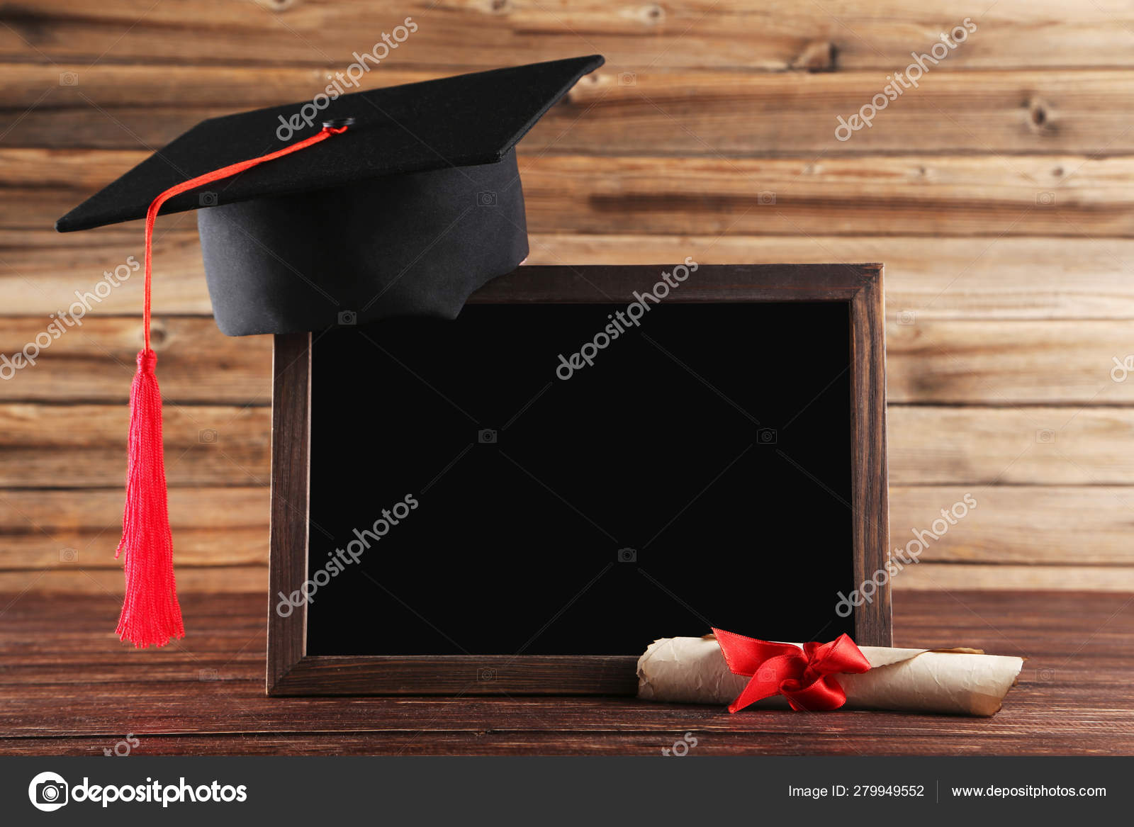Graduation cap with diploma and blank frame on brown wooden tabl Stock ...