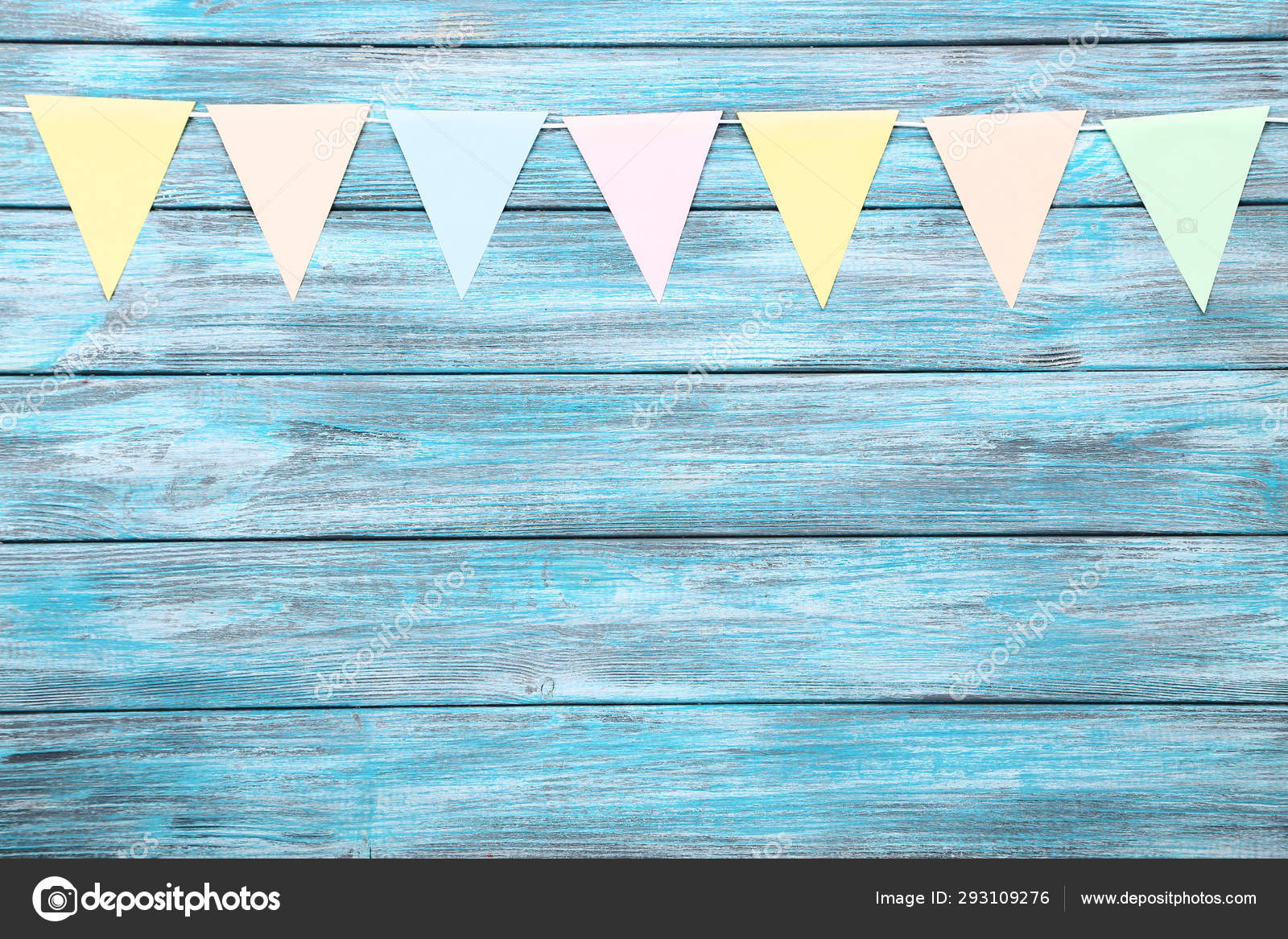 Colorful paper flags hanging on blue wooden background — Stock Photo ...