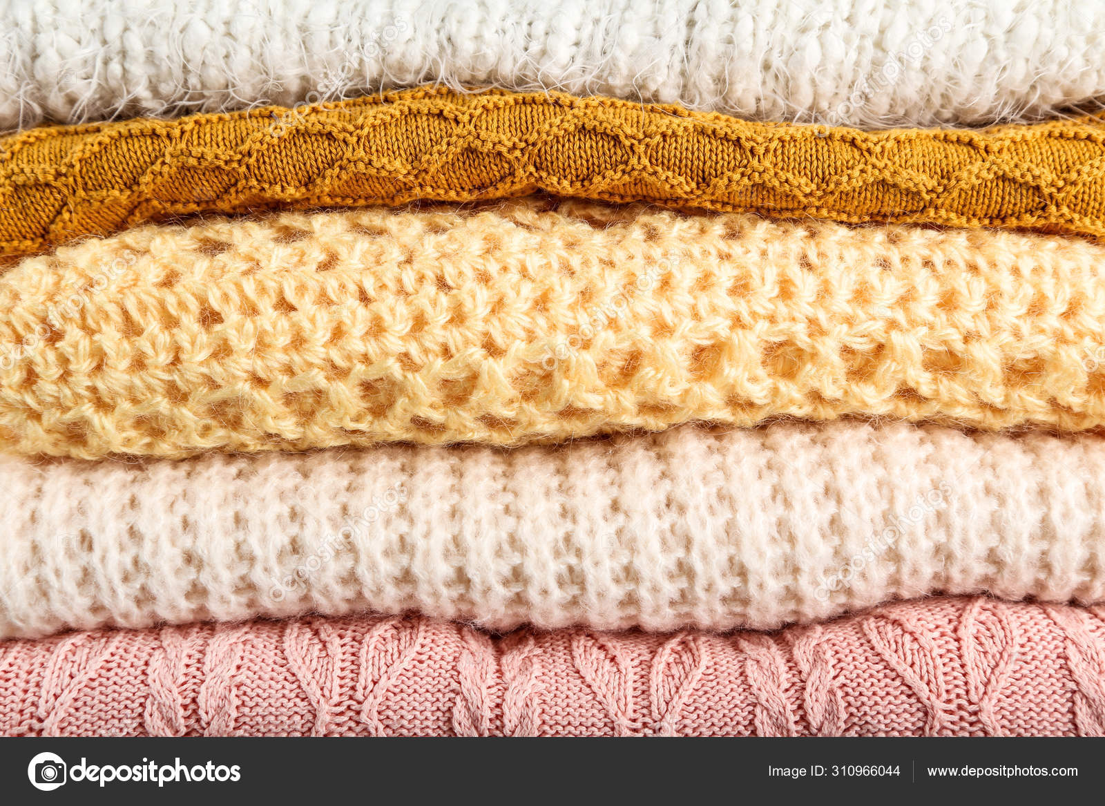 Background of folded colorful sweaters Stock Photo by ©5seconds 310966044