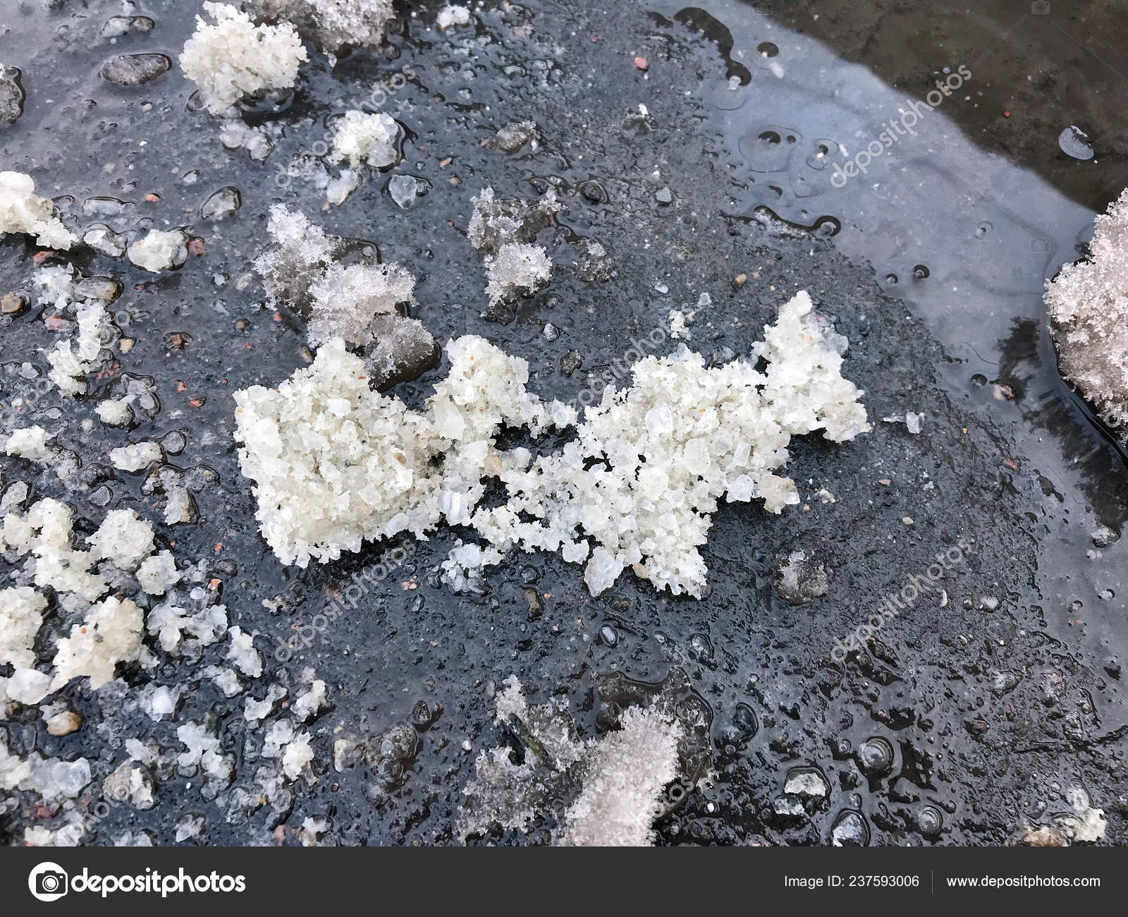 Salt spilled on the pavement. Winter season Stock Photo by ...