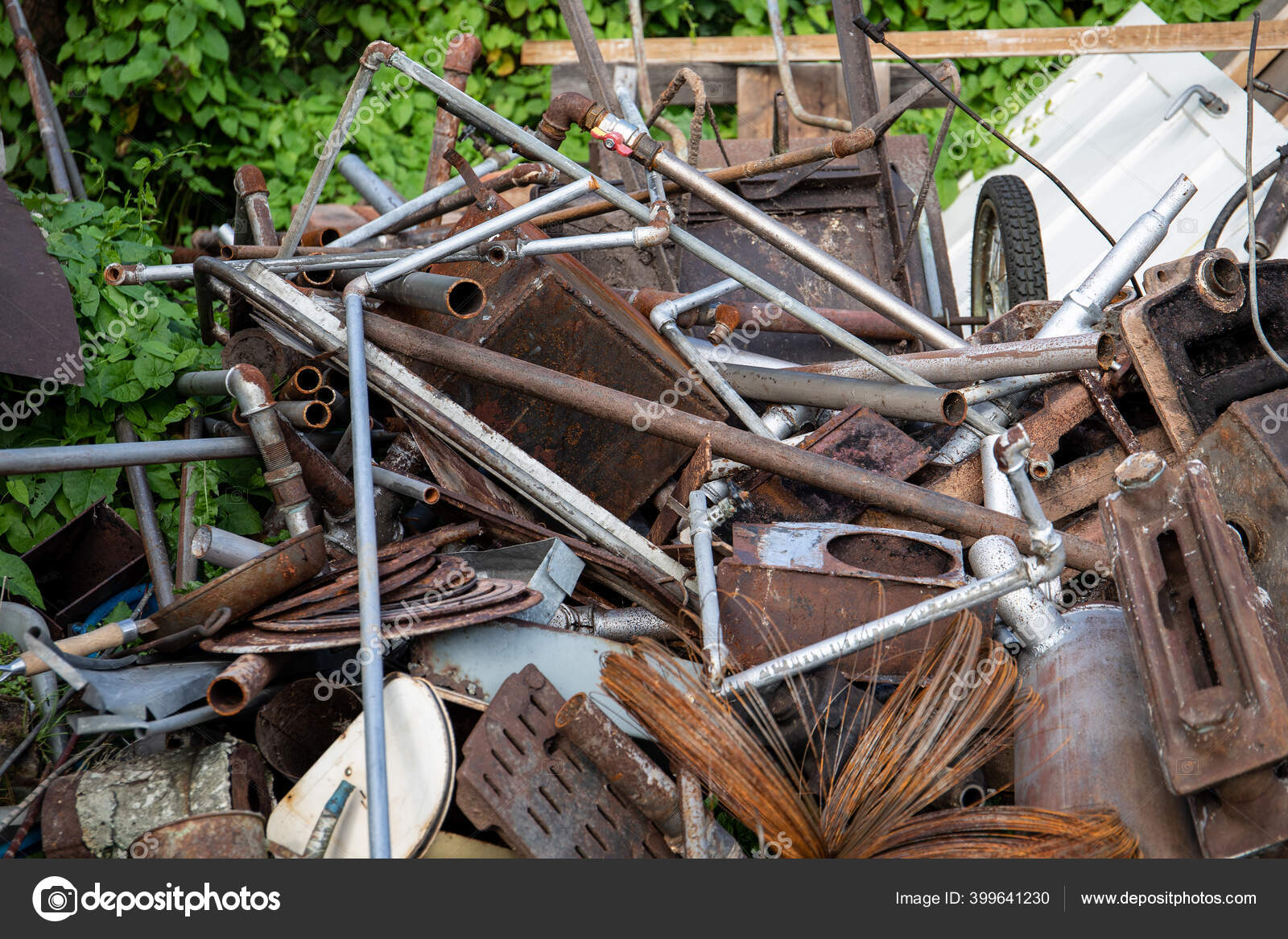 Stack of scrap metal, rusty pipes and wires outdoors. Recycling and ...