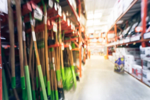 Blurred abstract variety of garden tools at hardware store in America ...