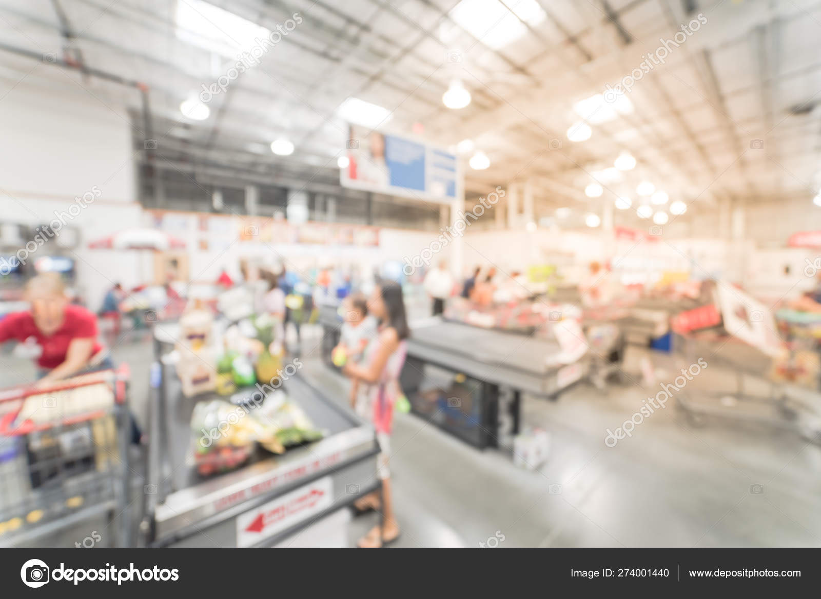 Blurry background busy checkout line at wholesale big-box store in ...