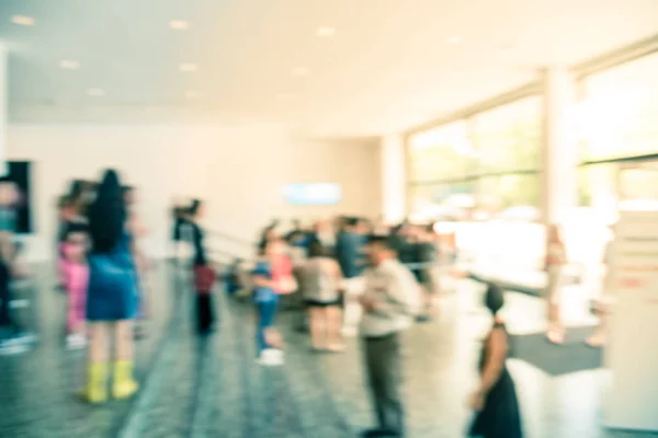 Blurry background busy museum entrance with crowd people walking and ...