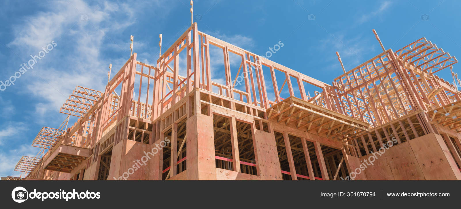 Panoramic upward view of multistory apartment building with patio under ...