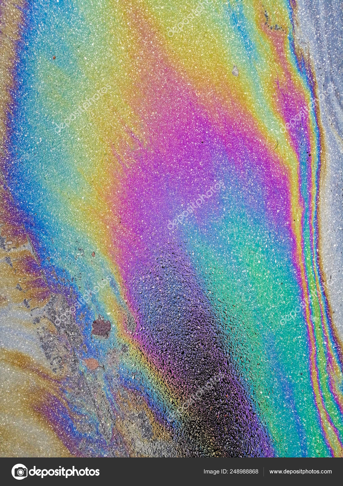 Multi colored oil spill on asphalt road, abstract background, Stock ...
