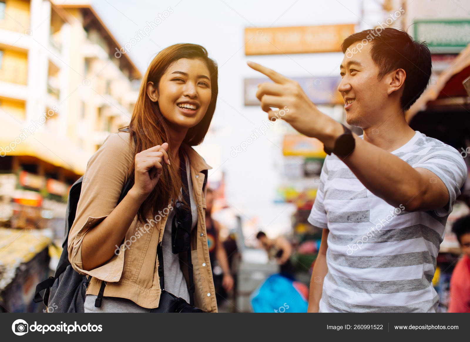 Young tourist asking for directions from local people ⬇ Stock Photo ...
