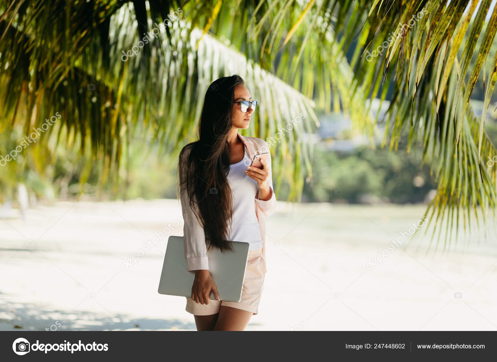 Freelancer working on the beach — Stock Photo © shevtsovy #247448602