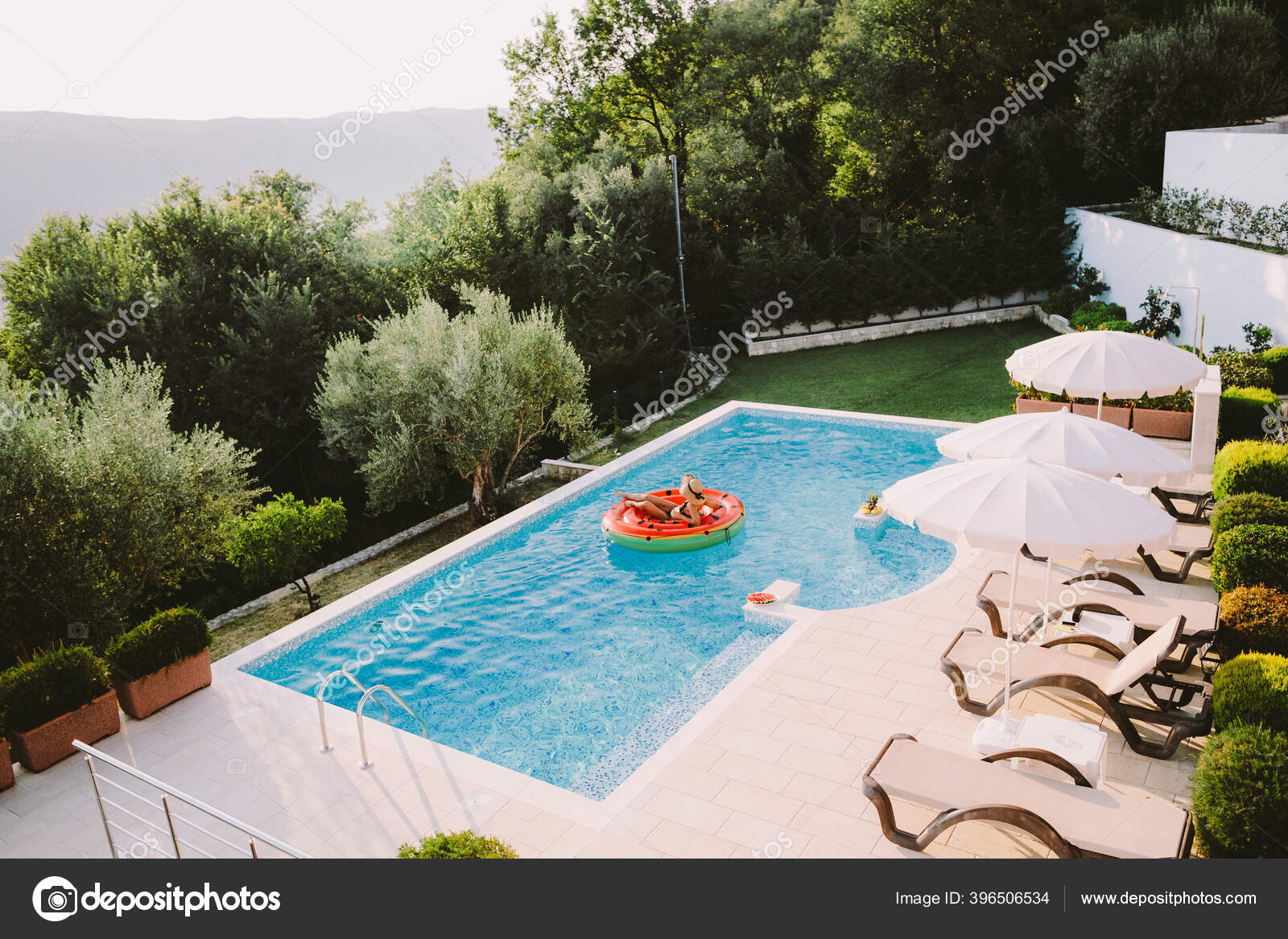Woman relax in swimming pool at sunset outdoors Stock Photo by ...