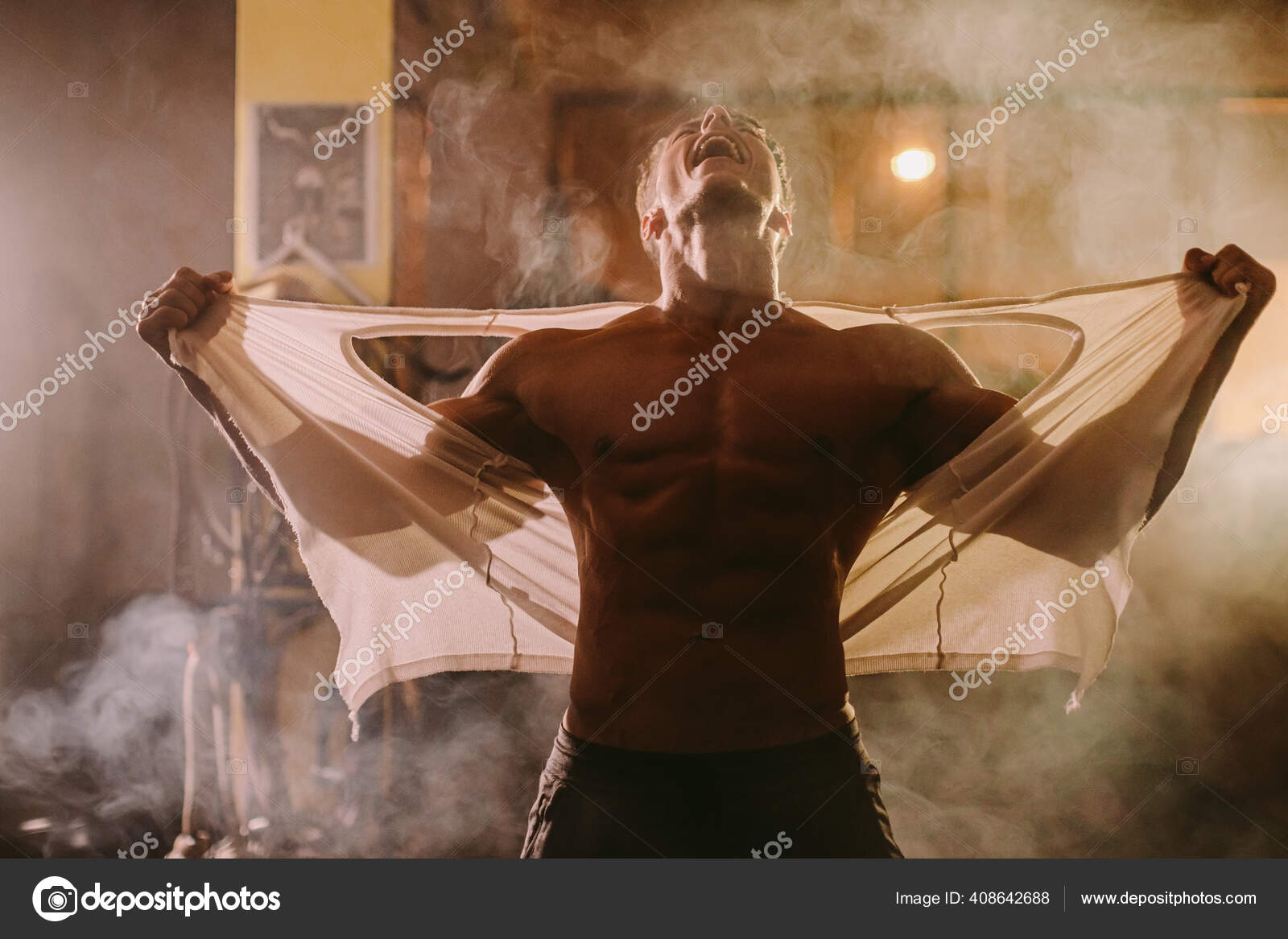 Sexy muscular man ripping shirt in gym emotionally and furious Stock ...