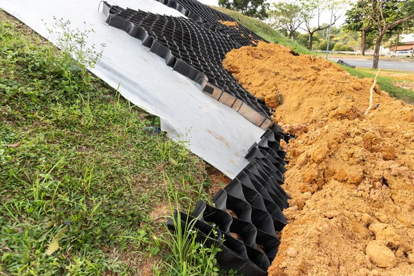 Slope erosion control with grids and earth on steep slope — Stock Photo ...