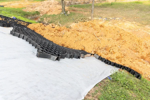 Slope erosion control with grids and earth on steep slope — Stock Photo ...