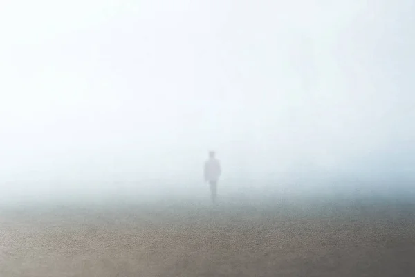 Man with his back walking through the fog street — Stock Photo ...