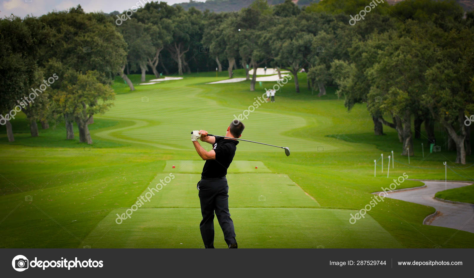 Man golfer on a golf course Stock Photo by ©isogood 287529744
