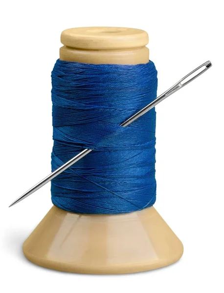 Bobbin of thread with needle — Stock Photo © billiondigital #187632766