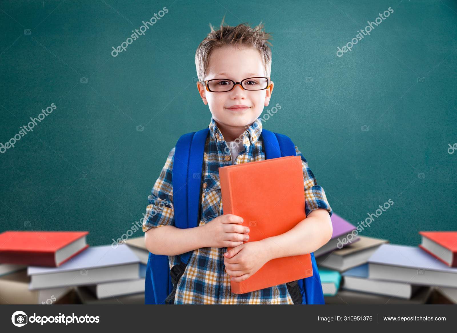 Little Schoolboy Holding Book Stock Photo by ©billiondigital 310951376