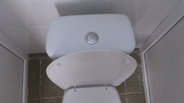 Public toilet cubicles. The camera moves smoothly from below between ...