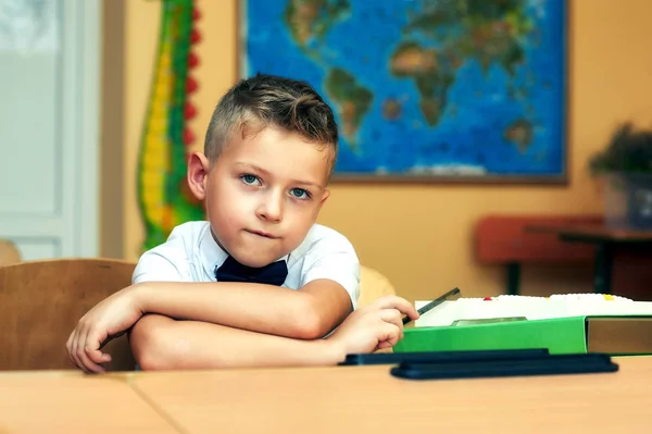 School-age boy crying and screaming while doing homework. the co Stock ...