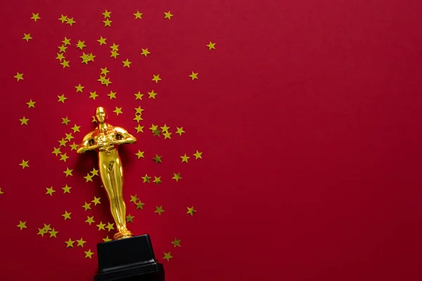 Gold Statue Trophy Stars Confetti Red Background Stock Photo by ...