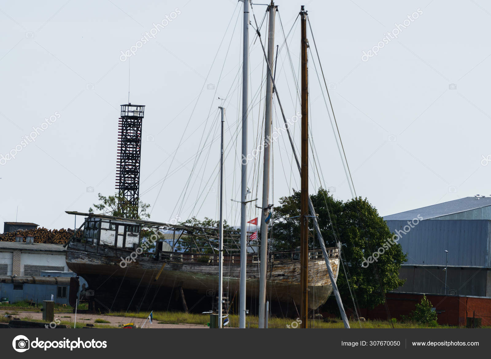 An old pier with old boats and longboats on a joke. Riga Gulf of the ...