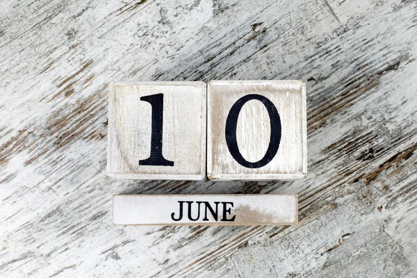 wooden calendar with date june, 10 - Stock Image - Everypixel