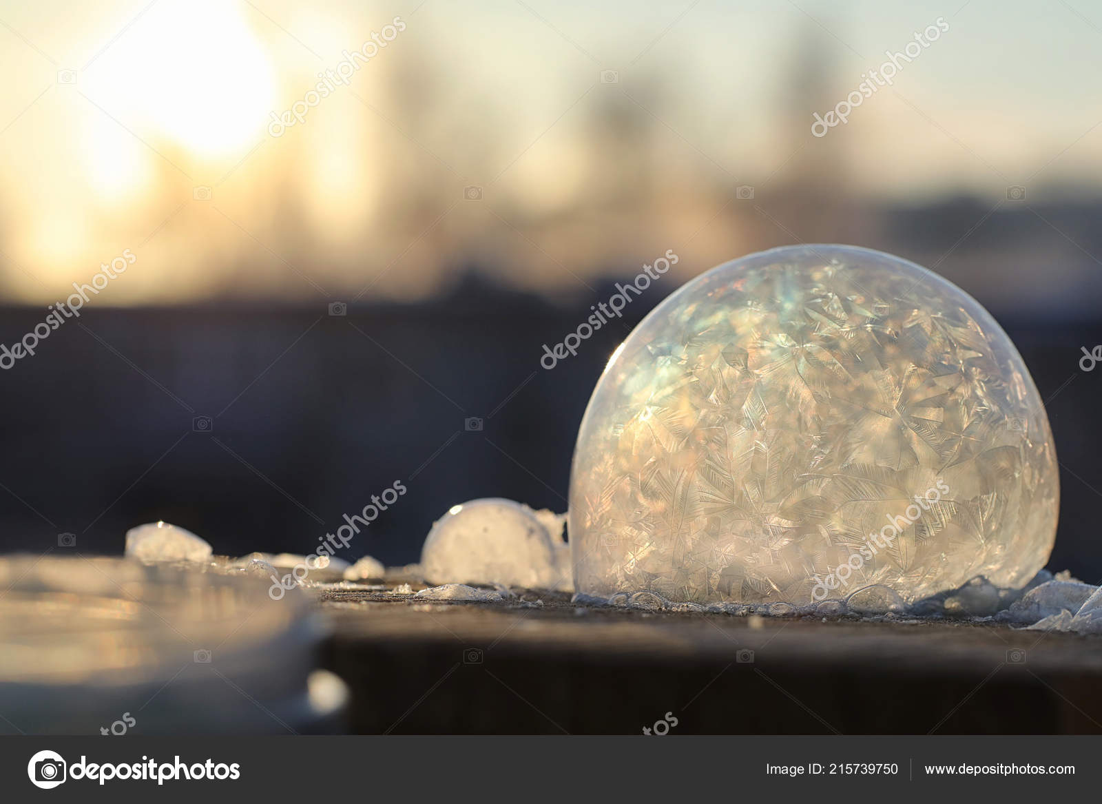 Soap bubbles freeze in the cold. Winter soapy water freezes in t ...