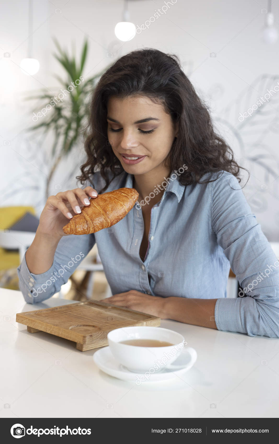Hungry Female Biting Croissant Cafe Stock Photo by ©Nikodash 271018028