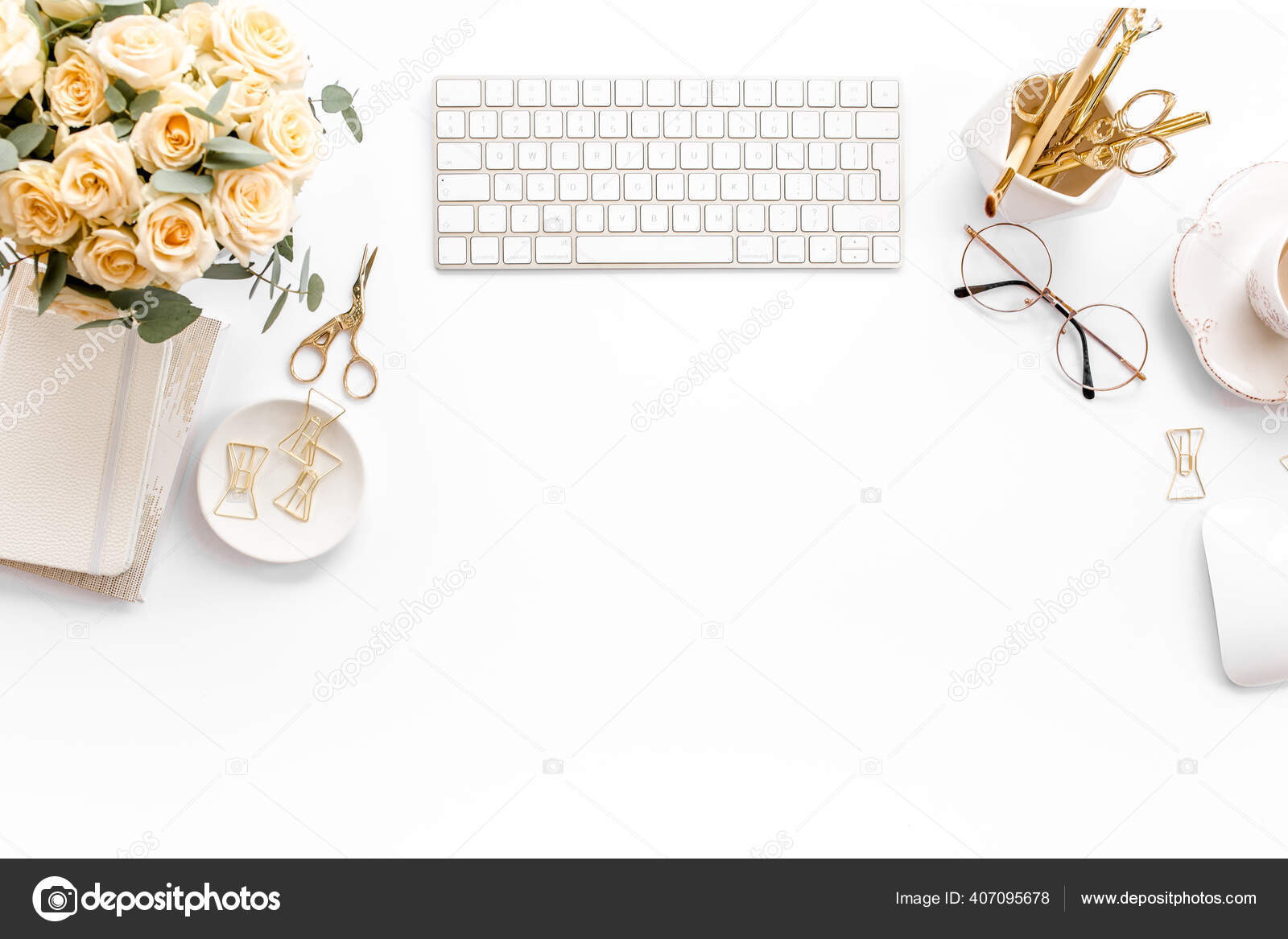 Female workspace with computer, roses flowers, golden accessories ...