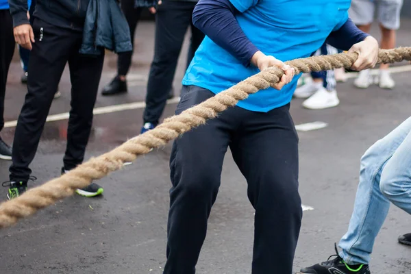 Men are pulling the rope. Sports competition. - Stock Image - Everypixel