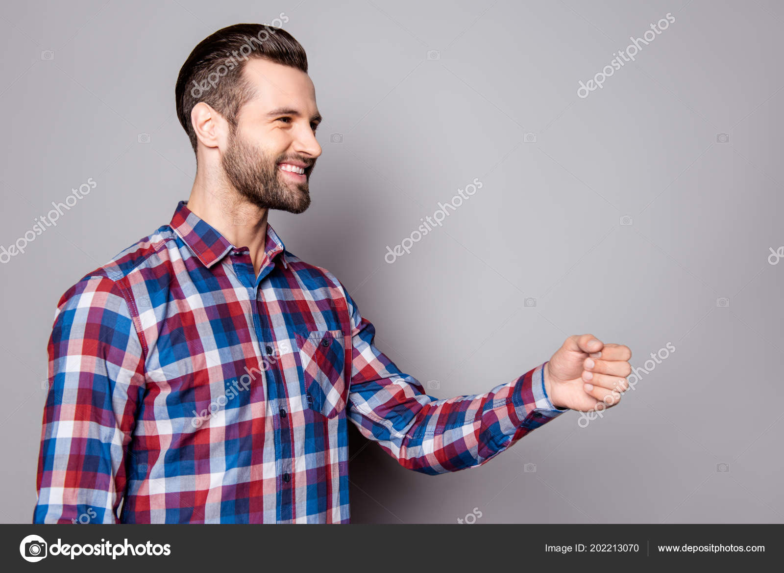 Side View Handsome Man Standing Gray Background Holding Something His ...