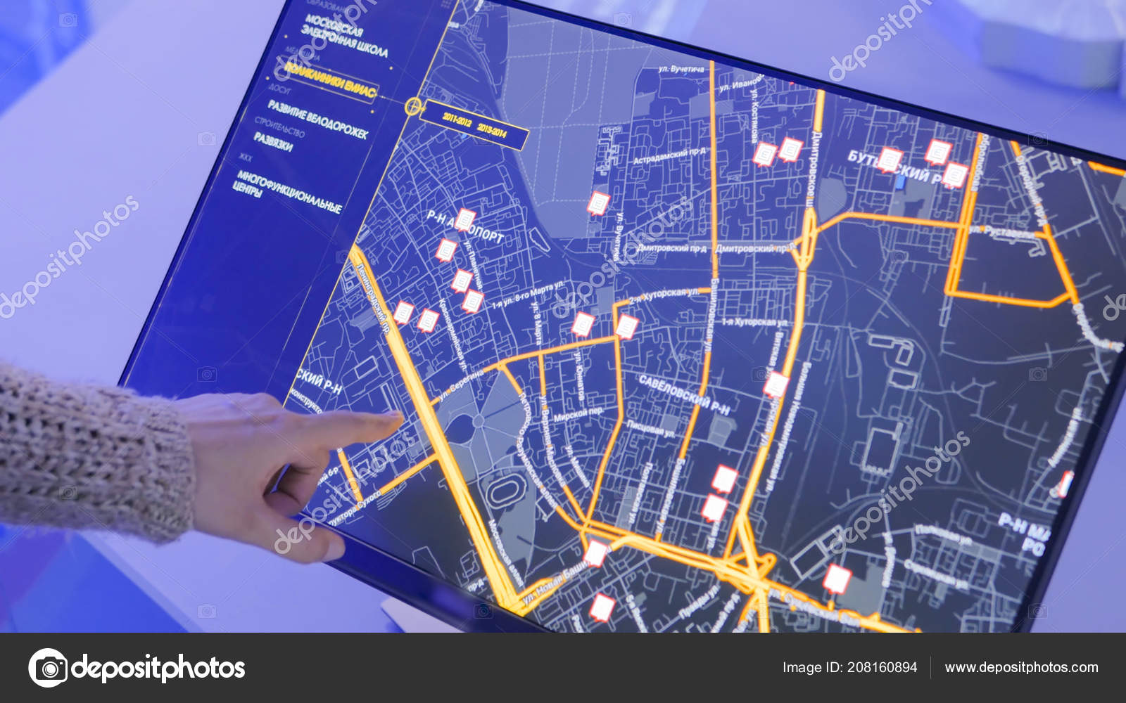 Woman using interactive touchscreen display at modern technology ... Woman using interactive touchscreen display at modern technology ...