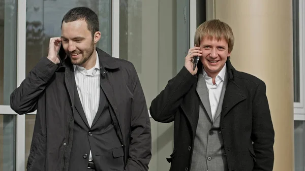 Business people calling by mobile phone. Happy and smiling - Stock ...