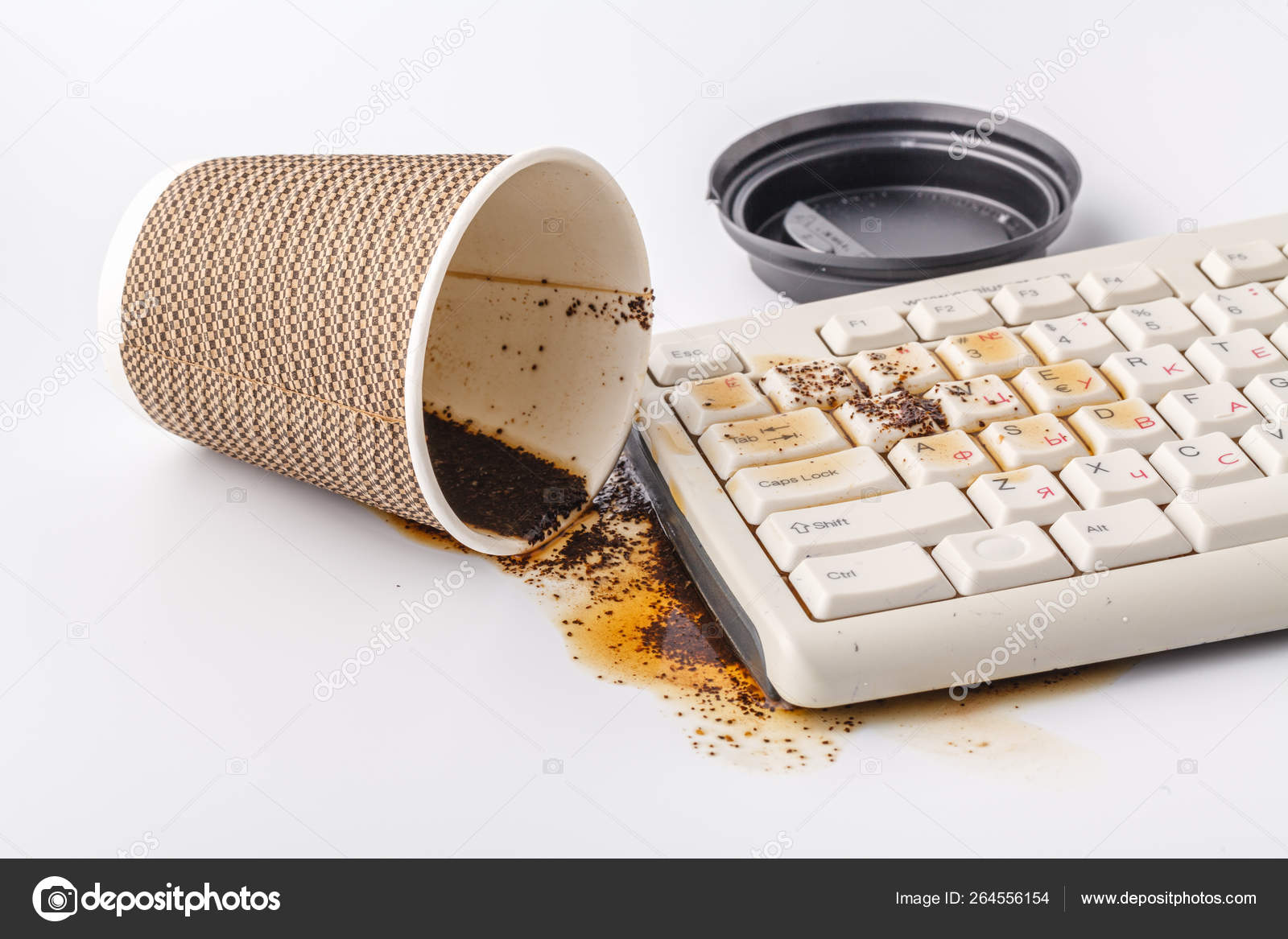Dont eat on workplace. Liquid spilled on a computer keyboard clo Stock ...
