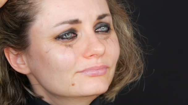 Beautiful young tearful unhappy woman crying washing off makeup. Real ...