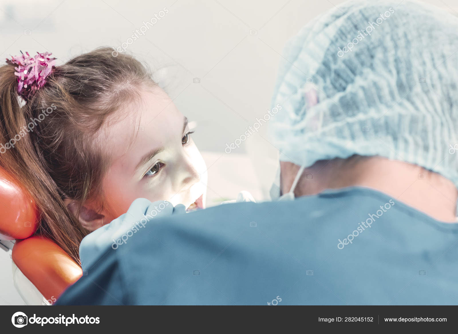 Dentist checking the teeth of a little child Stock Photo by ©frimufilms ...