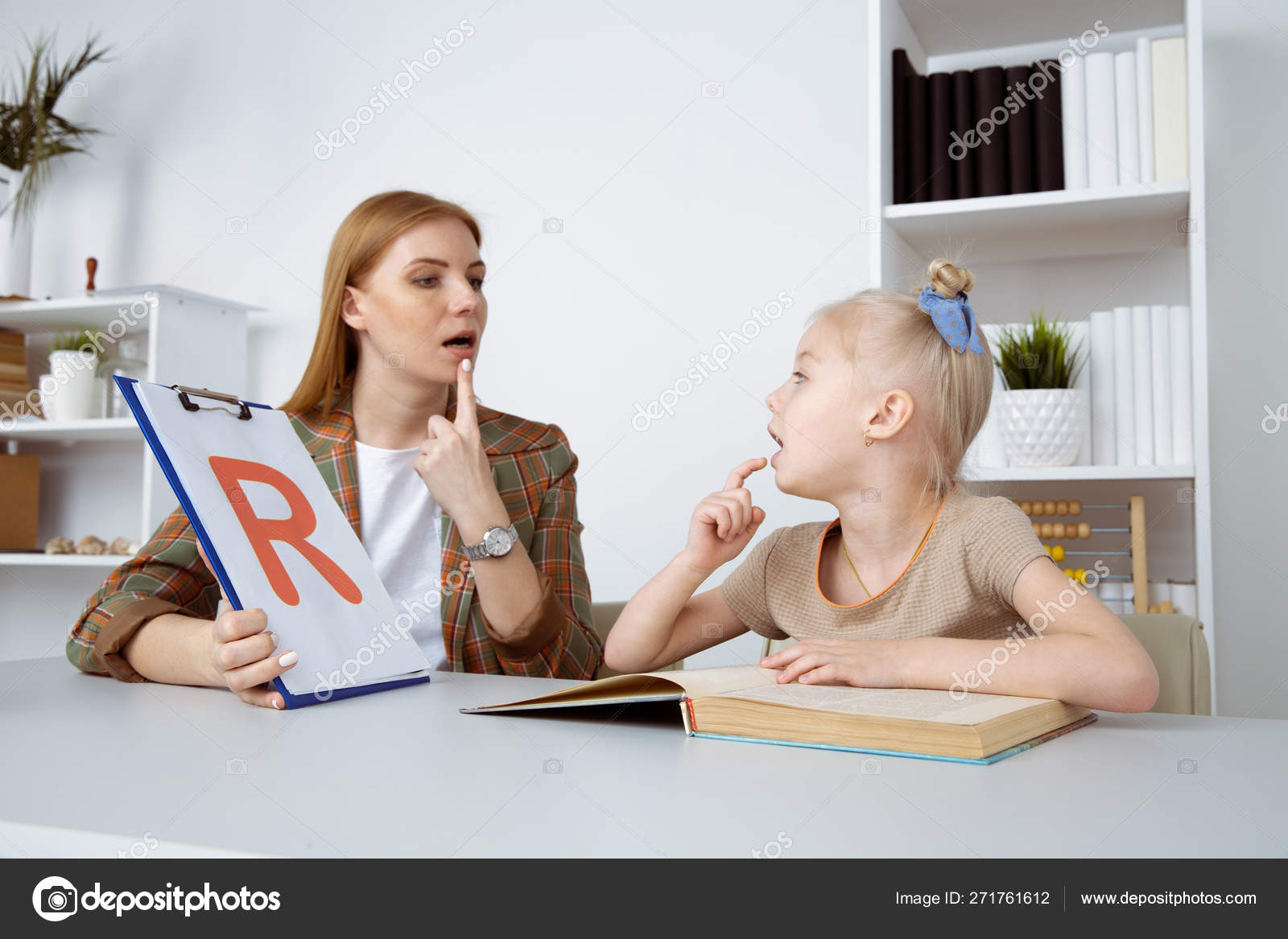 Speech therapy concept. Patient kid with female therapist training ...