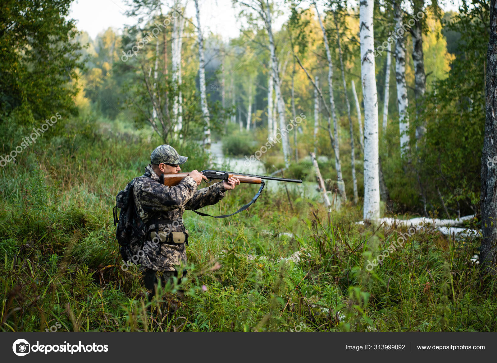 Hunter aiming with weapon at the outdoor hunting — Stock Photo ...
