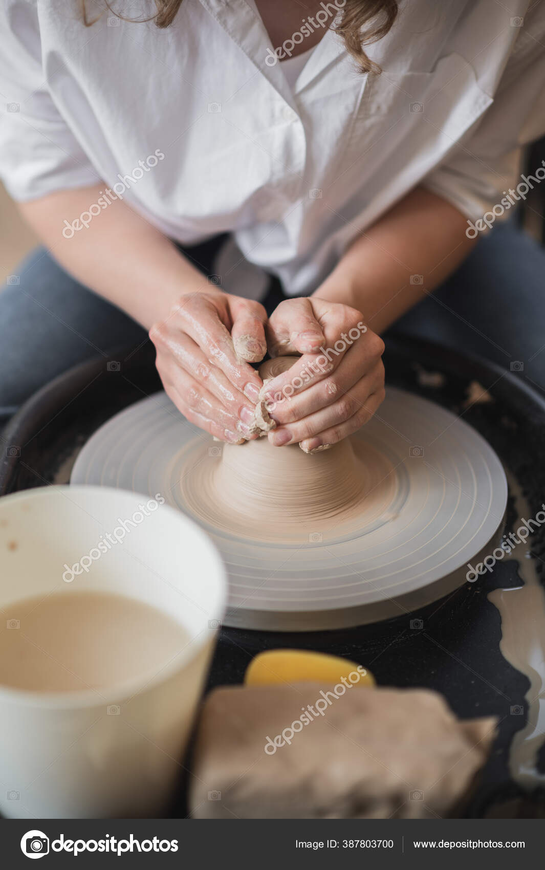 Master class on modeling of clay on a potter wheel In the pottery ...