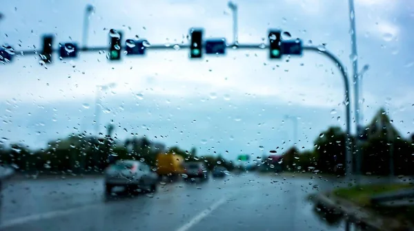 Rain droplets on car windshield . Look on the water drops on car ...