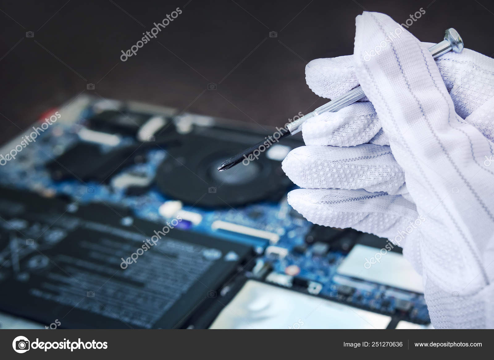 Engineer fixing broken computer at work. IT technician repairing broken ...