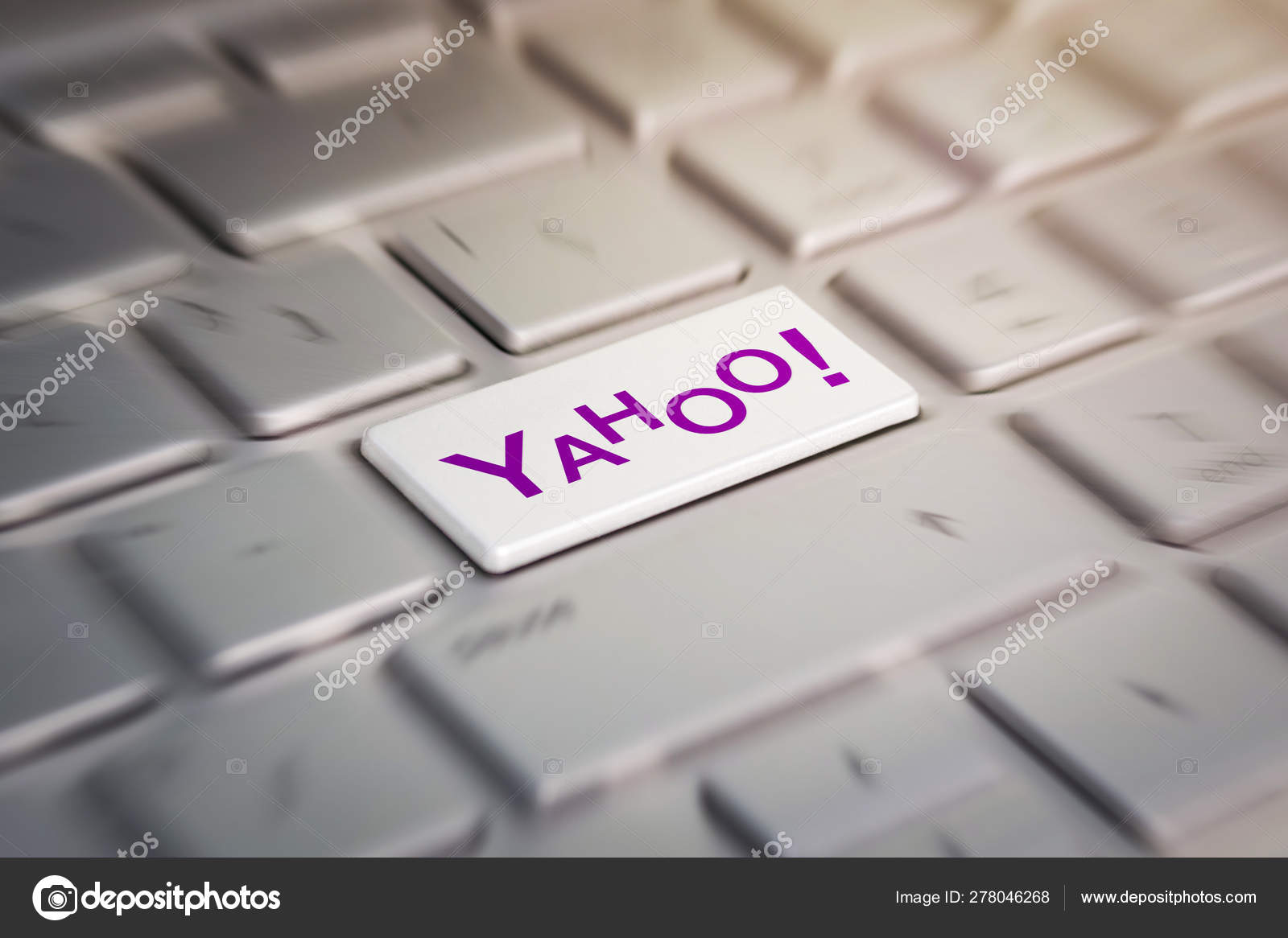Button with the company logo yahoo on the grey keyboard of a modern ...