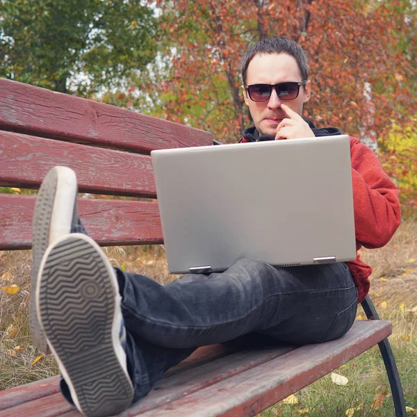 Young male student programmer work study outdoors. Programmer developer ...
