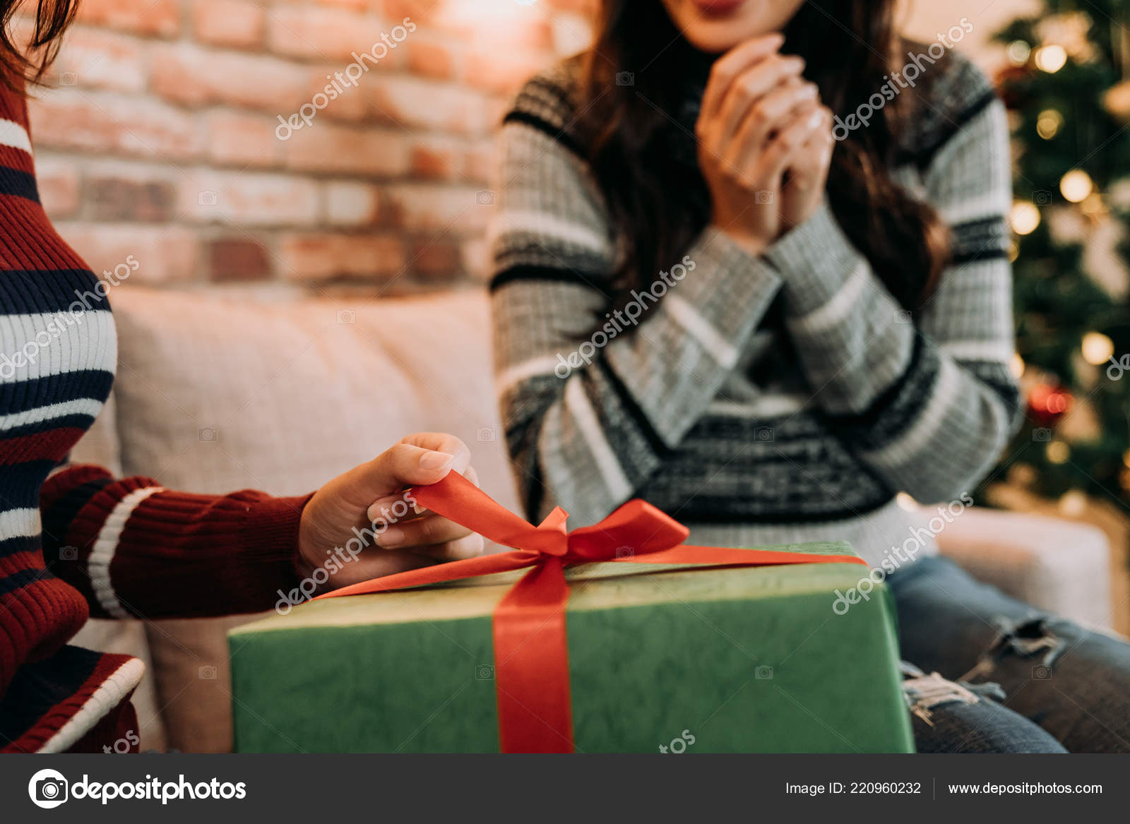 Young Ladies Opening Present Home Girl Pulling Ribbon Open Gift Stock ...