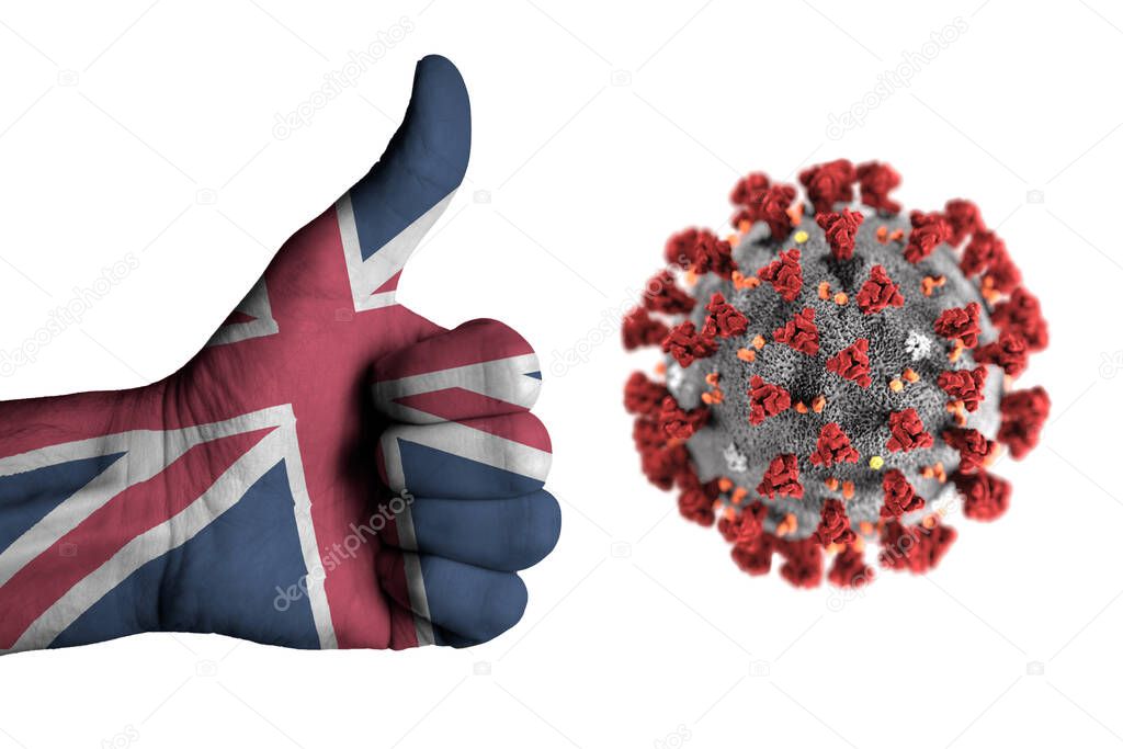 Union Jack bandera en el pulgar humano hacia arriba de la mano durante ...