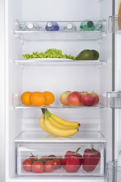 Open fridge full of fresh fruits and vegetables - Stock Image - Everypixel