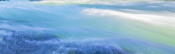 Flowing water through rapids as abstract background. - Stock Image ...