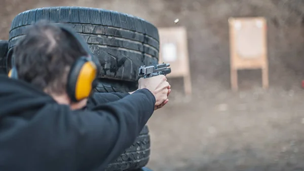 Advanced outdoor tactical shooting on target around barrier and wall ...