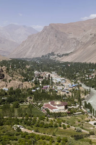 Gunt River with the city of Khorog in the Wakhan valley in Tajikistan ...